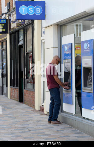 Man using a cash machine Stock Photo - Alamy