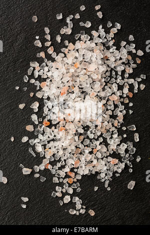 Himalayan pink salt on top of a rock. Selective focus Stock Photo - Alamy
