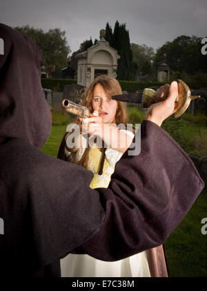 Victorian lady defending herself against an evil monk at halloween ...