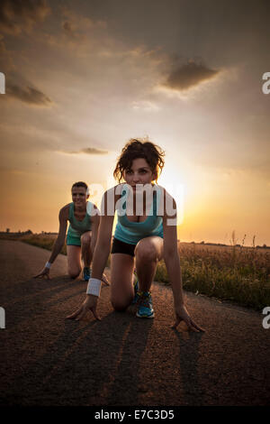 Two pretty girls jogging in the morning Stock Photo - Alamy