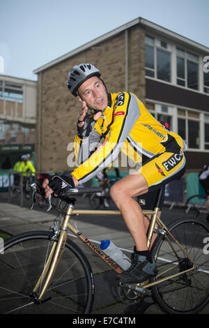 Scottish Cycling legend Graeme Obree is pictured with children from ...