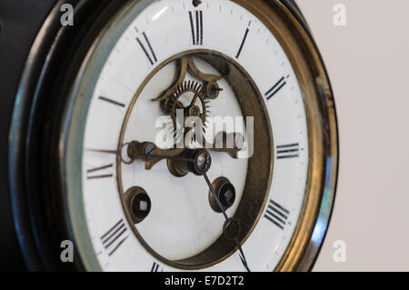 Old brass clock mechanism with pendulum, chime spring and three small ...