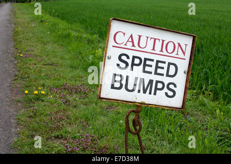 Caution speed bumps traffic sign Stock Photo - Alamy