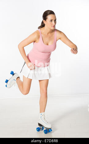 Female roller skater skating on quad skates Stock Photo - Alamy