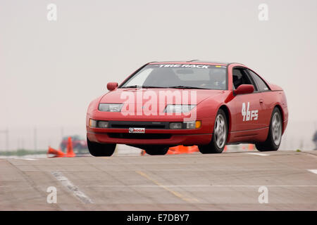 A 1990 Red Nissan 300ZX in an autocross race at a regional Sports Car ...