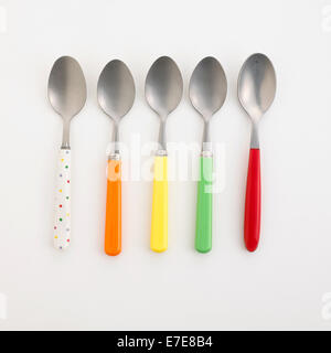 Teaspoons with colored handles Stock Photo - Alamy