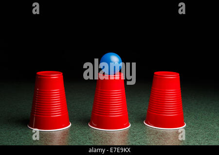 Magic trick with three cups and a ball Stock Photo: 102675104 - Alamy