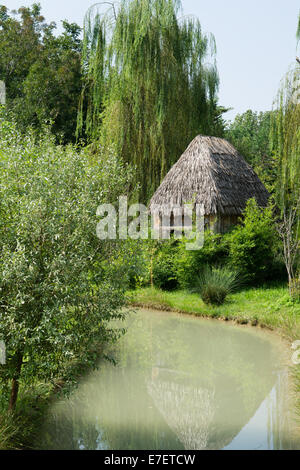 thatched hut on the river bank Stock Photo - Alamy