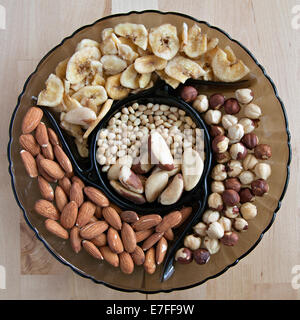Mixed nuts in a glass plate. Healthy and natural nutrition .Cashew ...