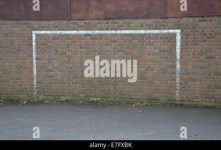 Painted goalposts on a brick wall Stock Photo - Alamy