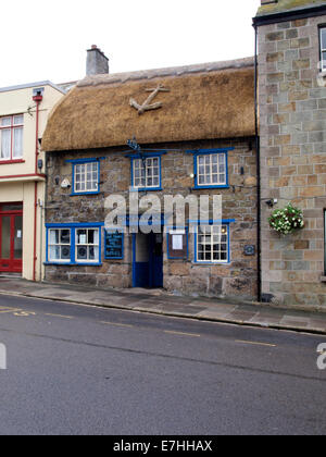 The Blue Anchor Inn, an old traditional public house with a thatched ...