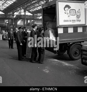 1950s historical picture showing a British Railway's guard with flag ...