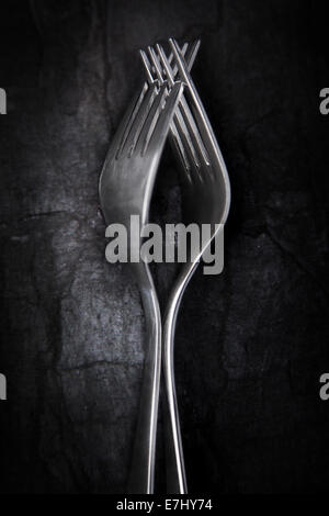 two forks joined Stock Photo - Alamy