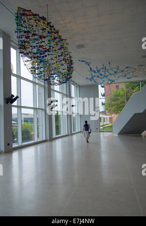 A woman walks through the atrium in the Scottish National Portrait ...