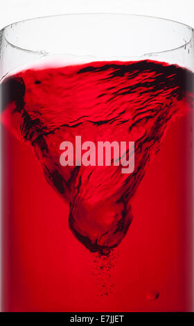 swirl of red liquid small typhoon Stock Photo - Alamy