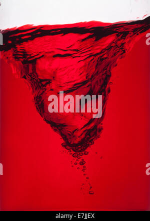 swirl of red liquid small typhoon Stock Photo - Alamy