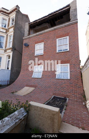 'From the knees of my nose to the belly of my toes', the house sliding ...