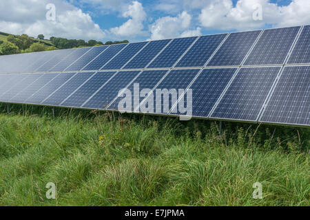 Section of racked fixed tilt PV / Photo-voltaic solar farm array of ...
