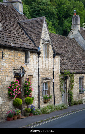 Homes and shops along the High Street, Castle Combe, the Cotswolds ...