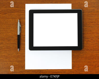 Tablet, pen and paper on wooden background Stock Photo - Alamy
