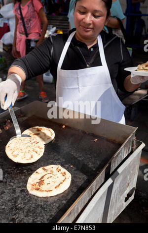Woman making pupusas at an outdoor festival - USA Stock Photo - Alamy