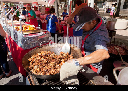 Man cooking chicharon in large pan - USA Stock Photo - Alamy