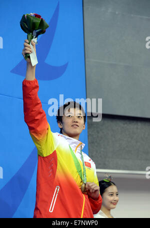 Shun Wang of China, poses with his bronze medal for the men's 200-meter ...