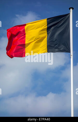 flag of Belgium against blue cloudy sky, Belgium Stock Photo - Alamy
