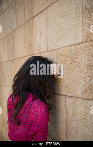 Portrait of depressed woman standing against white background Stock ...