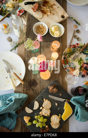 View of messy table after party indoors Stock Photo - Alamy