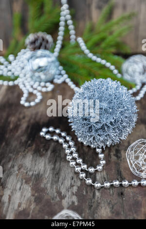 Silver Christmas ball on fir tree at night, closeup Stock Photo - Alamy