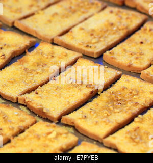 Delicious biscuit roll with apricot jam on a white wooden table ...