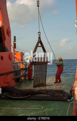 To pick up stones from deep submarine Walvis Ridge volcanoes the crew ...