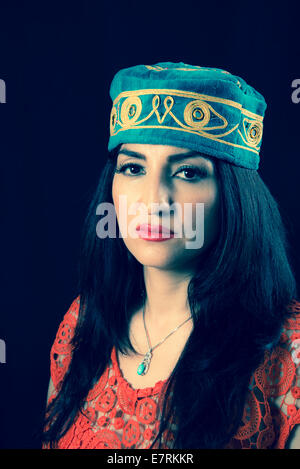 Beautiful middle age woman wearing winter sweater and hat over isolated ...