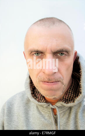Wicked man, a portrait of a man with the pursed lips looking straight ...