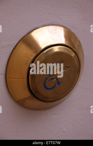 Disabled accessible push button sign at shop entrance Stock Photo - Alamy