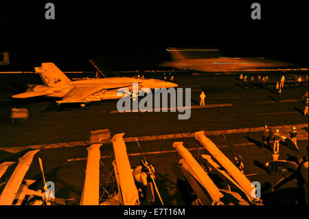 An F/A-18F Super Hornet is launched from the flight deck aboard USS ...