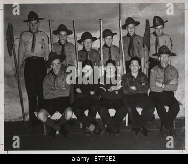This photograph shows a group of Boy Scouts participating in a fire ...