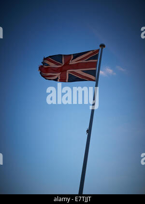Union jack isolated against blue sky Stock Photo - Alamy