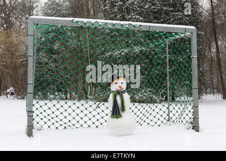 Funny snowman defending the soccer goal in the park Stock Photo - Alamy