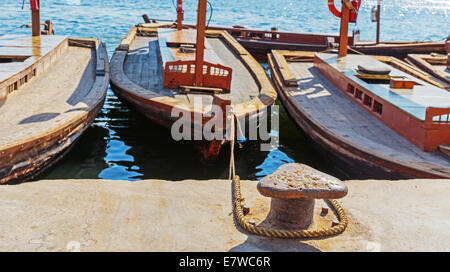 Traditional Abra boat at the pier in Dubai Stock Photo - Alamy