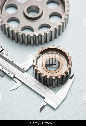 gears and caliper on graph paper Stock Photo - Alamy
