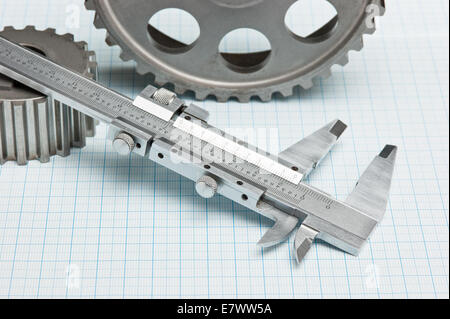 gears and caliper on graph paper Stock Photo - Alamy
