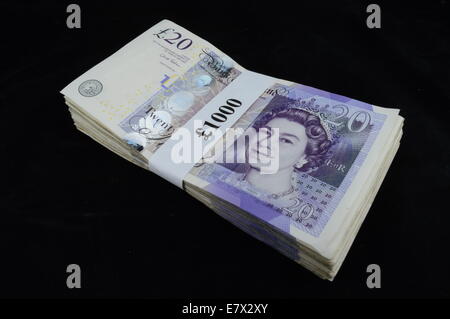 Wad of twenty pound notes cash in hands Stock Photo: 50723720 - Alamy