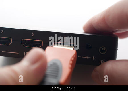 Hand holding HDMI cable Stock Photo - Alamy