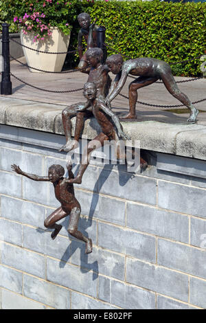 People of the River statue by Chong Fah Cheong of children jumping into ...