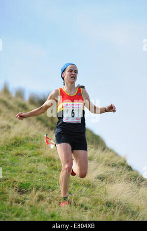 Female Fell runner running downhill Stock Photo - Alamy