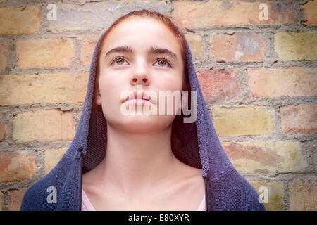 Maria like portrait of a teenager girl in front of an old wall Stock ...