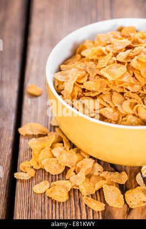 Portion of golden Cornflakes on wooden background (close-up shot Stock ...