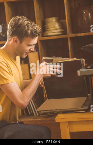 Happy smiling young man with a vinyl record Stock Photo - Alamy